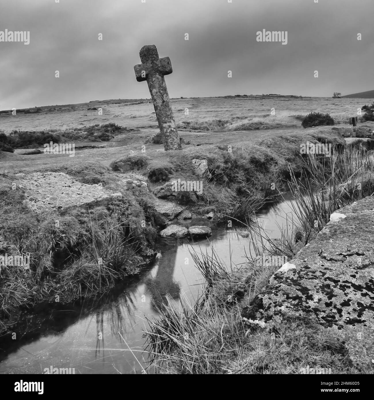 Windy Post, a tilted granite cross standing on moorland alongside a ...