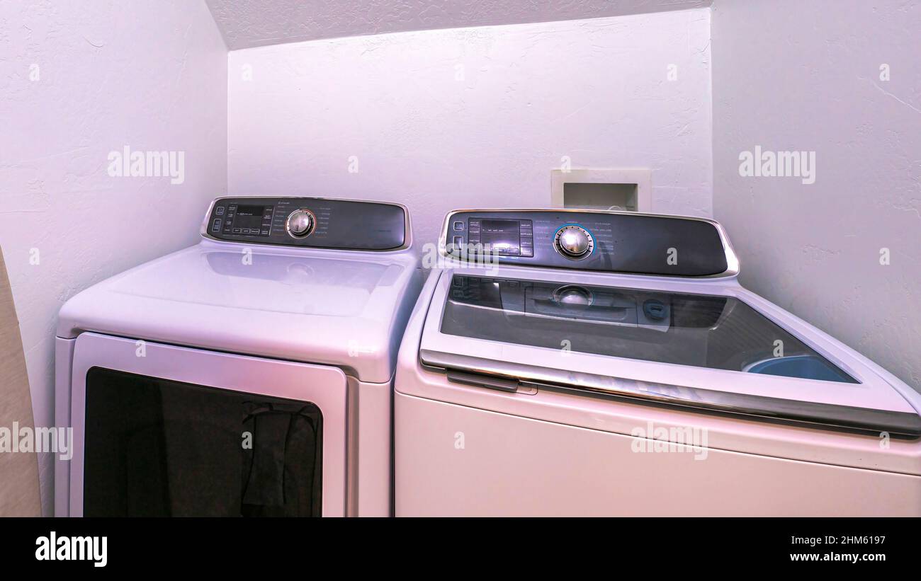Panorama Small tight laundry room with slope ceiling and laundry ...