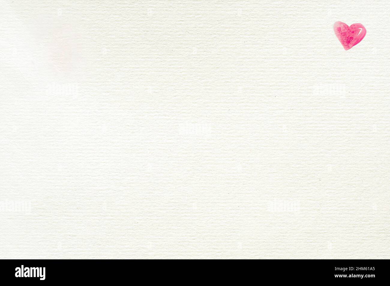 Love background with one watercolor heart painted top right on a ...