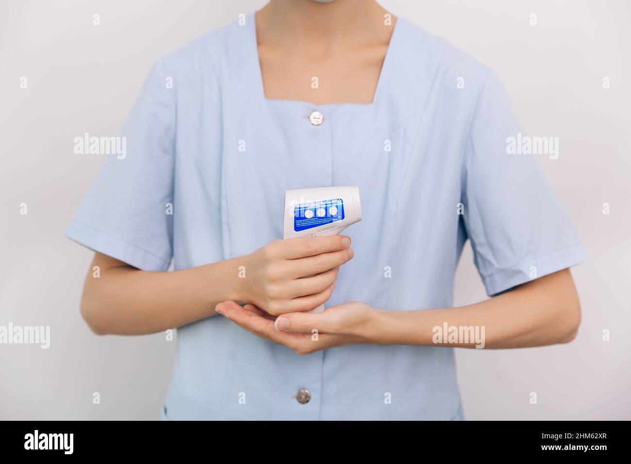 Temperature measurement gun in doctor hands. Close-up shot of doctor ...