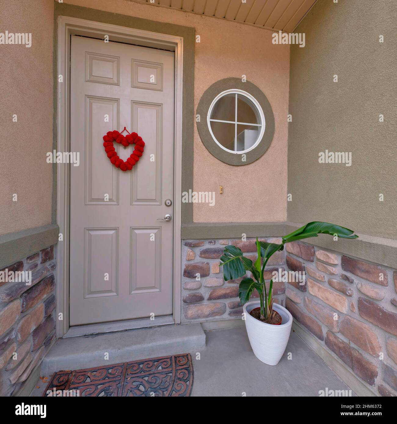 Square Front door exterior with red heart-shaped display at the front ...