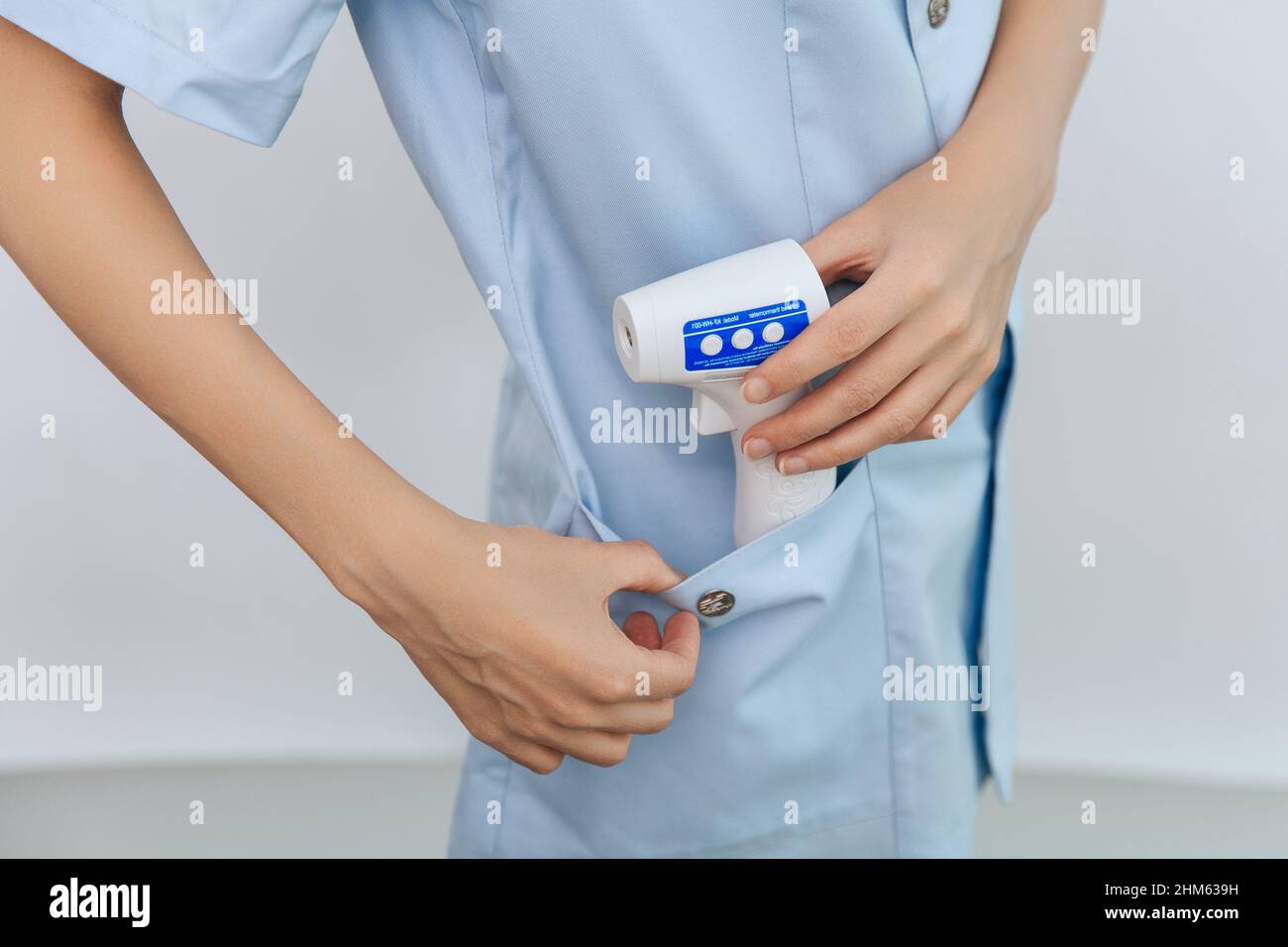 Temperature measurement gun in doctor hands. Close-up shot of doctor ...