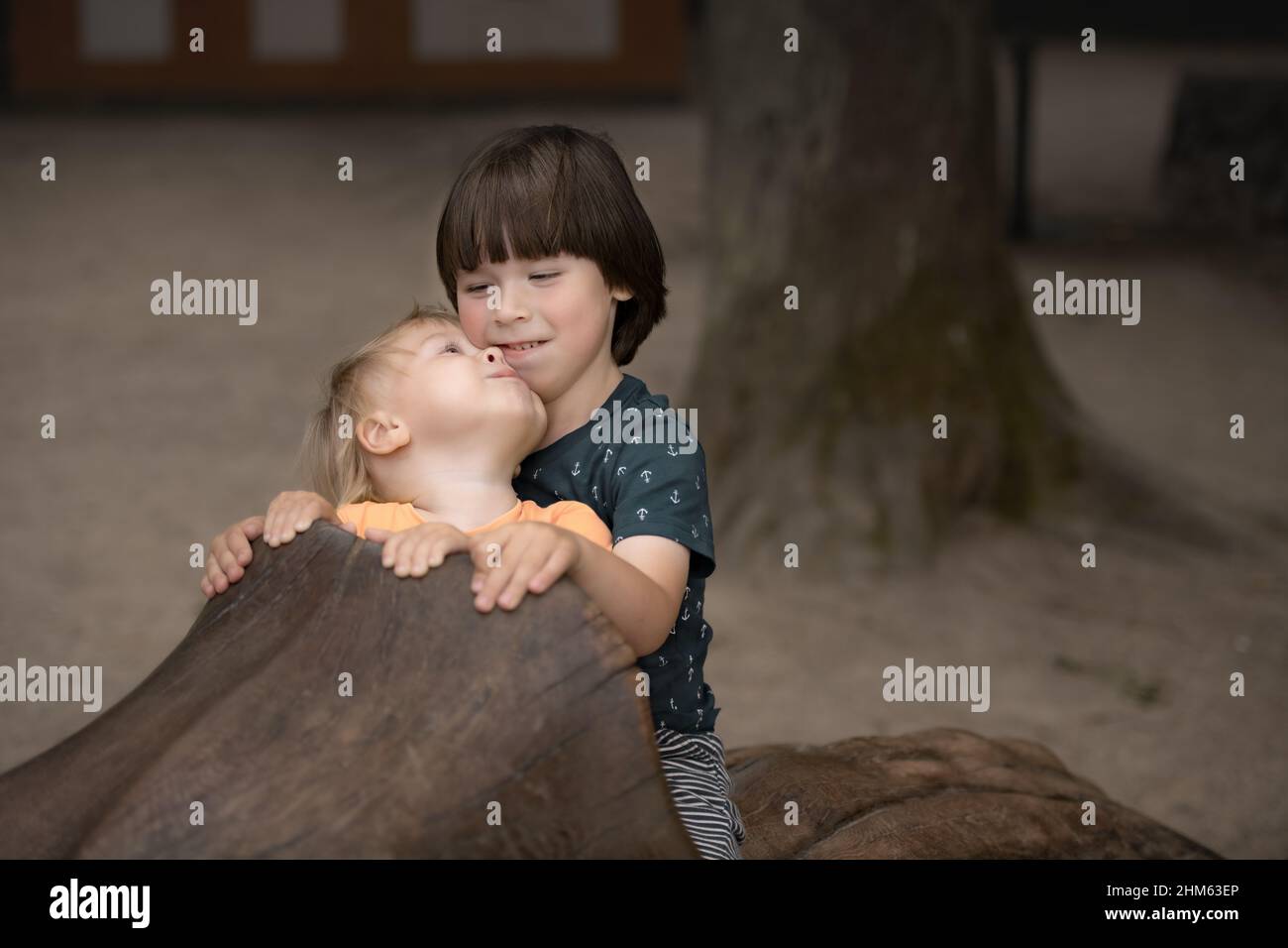 Two boys play each other at playground, family time Stock Photo - Alamy