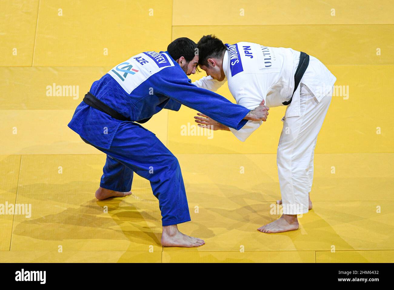 Men's -90 kg, Mammadali Mehdiyev (blue) of Azerbaijan and Murao Sanshiro (white) of Japan ...