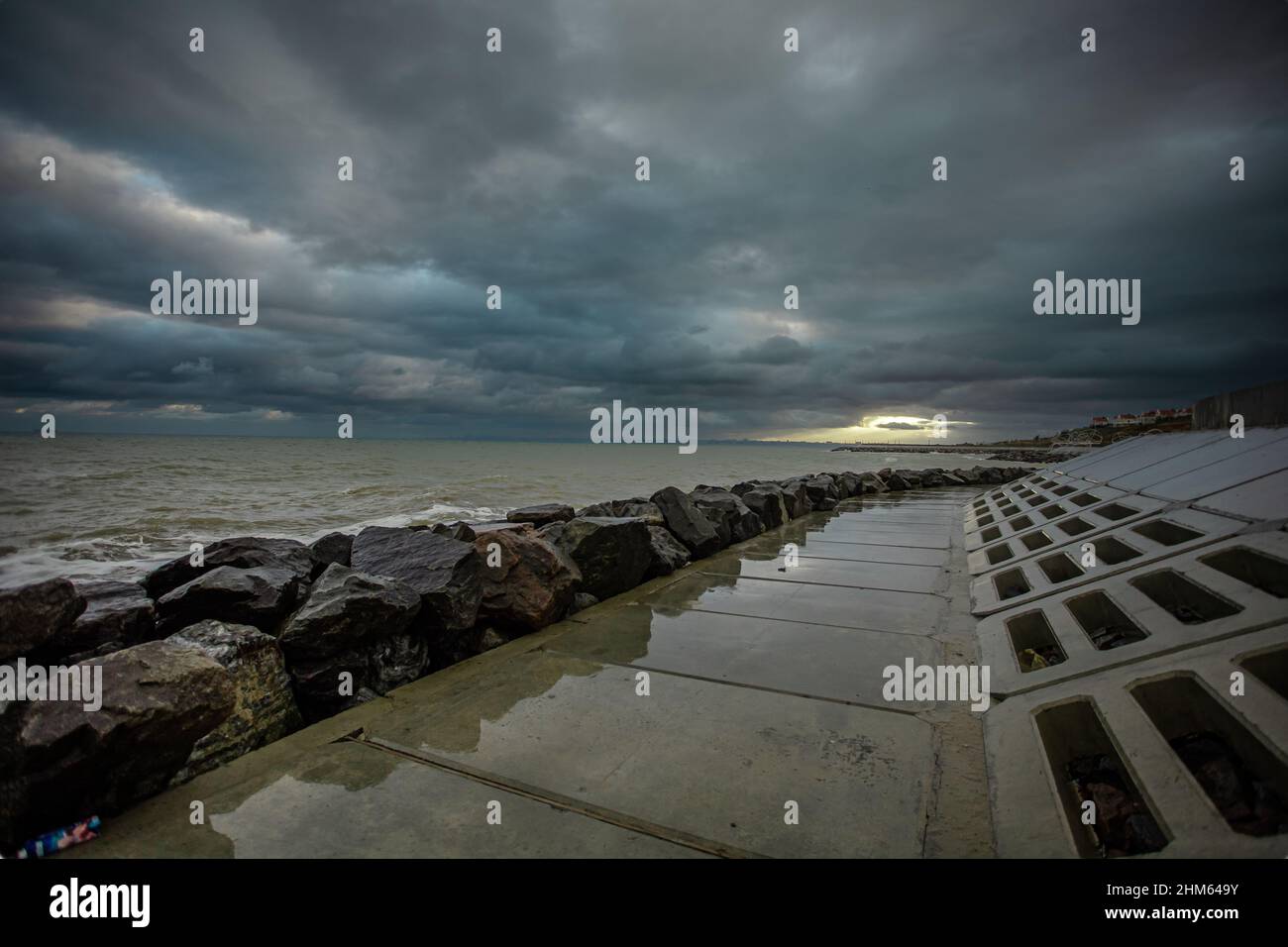 dramatic sky over the black sea with waves, clouds and stones Stock ...