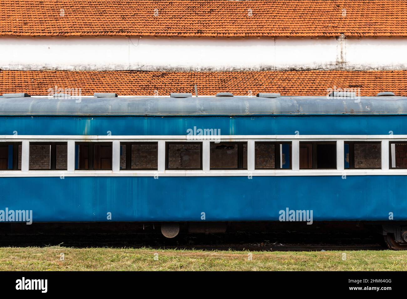 Old blue wagon stopped at a historic railway station in Brazil Stock ...