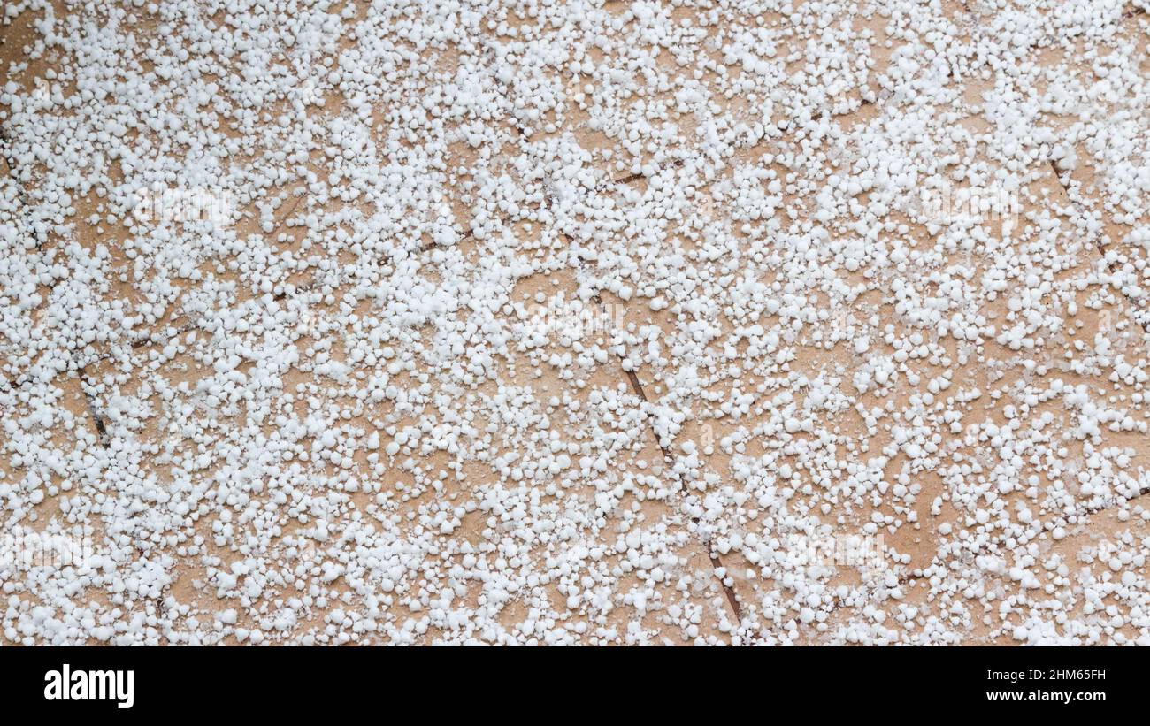 Snow grains on tiles of balcony in winter Stock Photo - Alamy