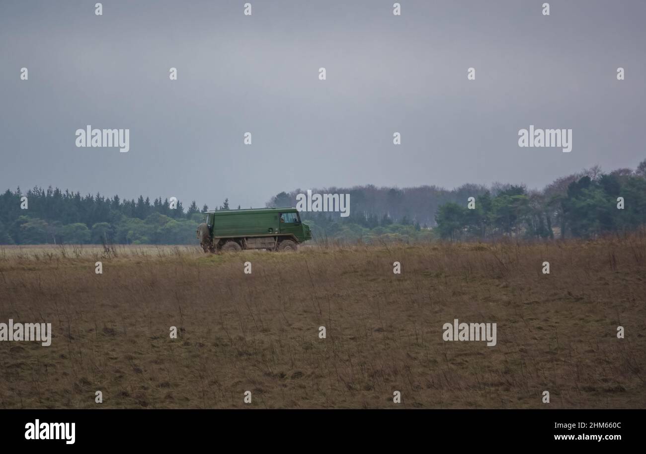 British army Pinzgauer High-Mobility All-Terrain 4x4 vehicle drives ...