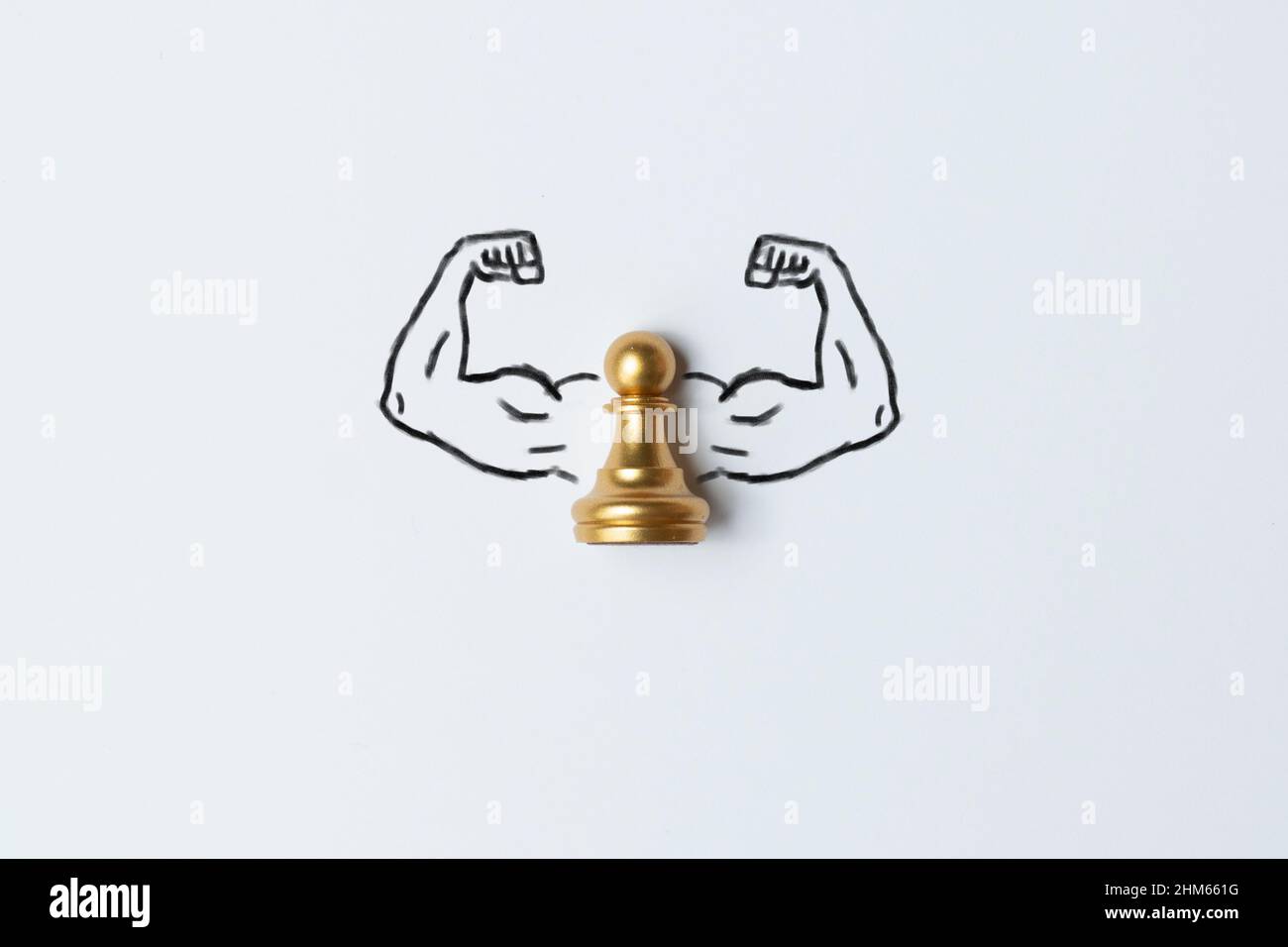 The concept of a business strong person. Arms muscles drawn with a pawn ...
