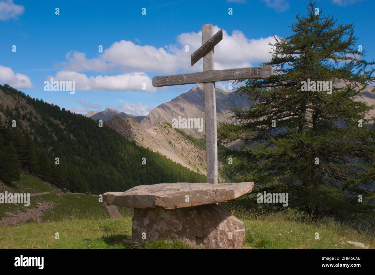 Beautiful view of cross in a landscape with trees under the blue sky ...