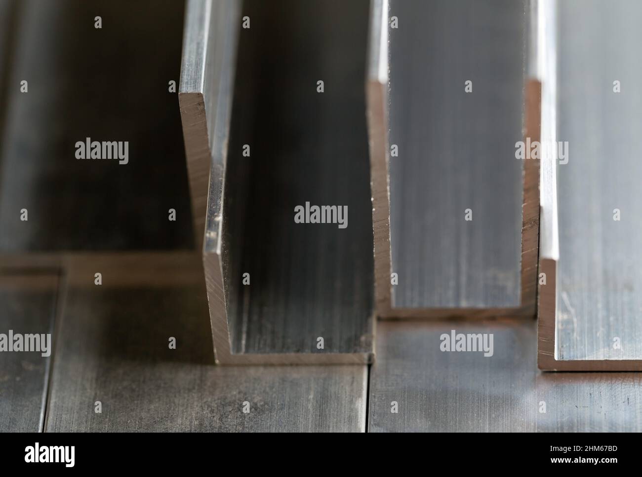 Abstract stack of aluminium profiles close up, industrial background ...