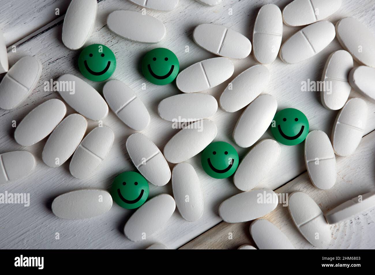pills of antidepressant with emoticons on a wooden table top view Stock ...