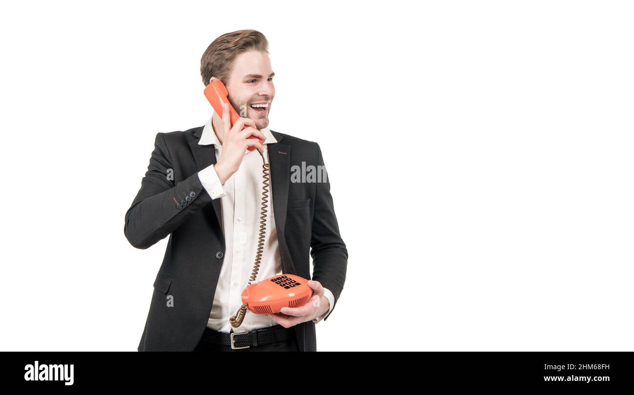 Happy professional man in suit is on retro phone isolated on white copy ...