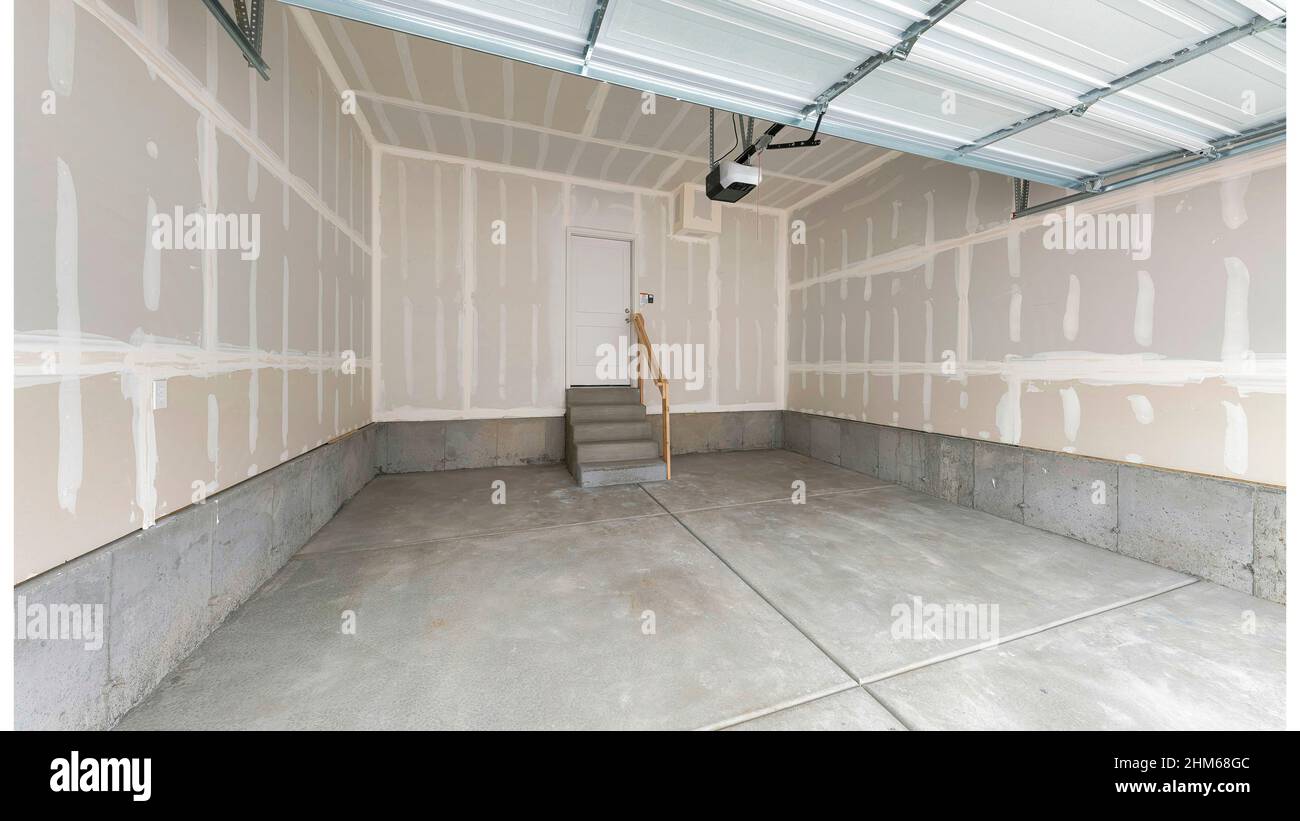 Panorama Unfinished garage interior with white markings on the wall ...