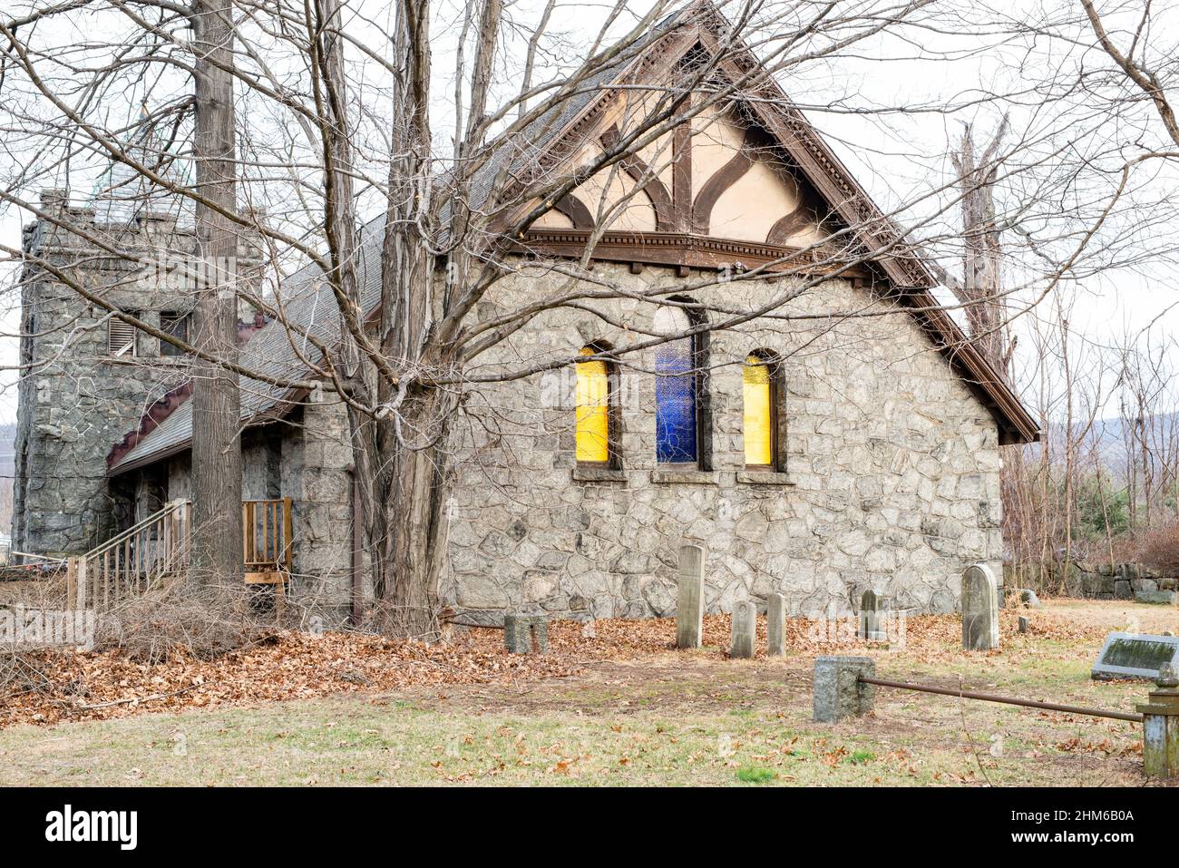 Old Stone Church with windows glowing golden from sunset Stock Photo ...