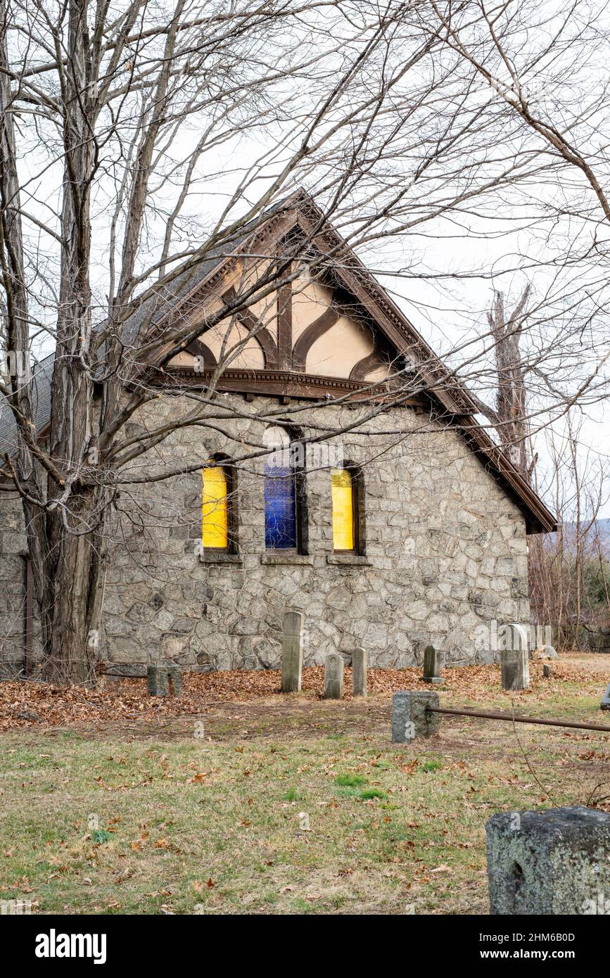 Old Stone Church with windows glowing golden from sunset Stock Photo ...