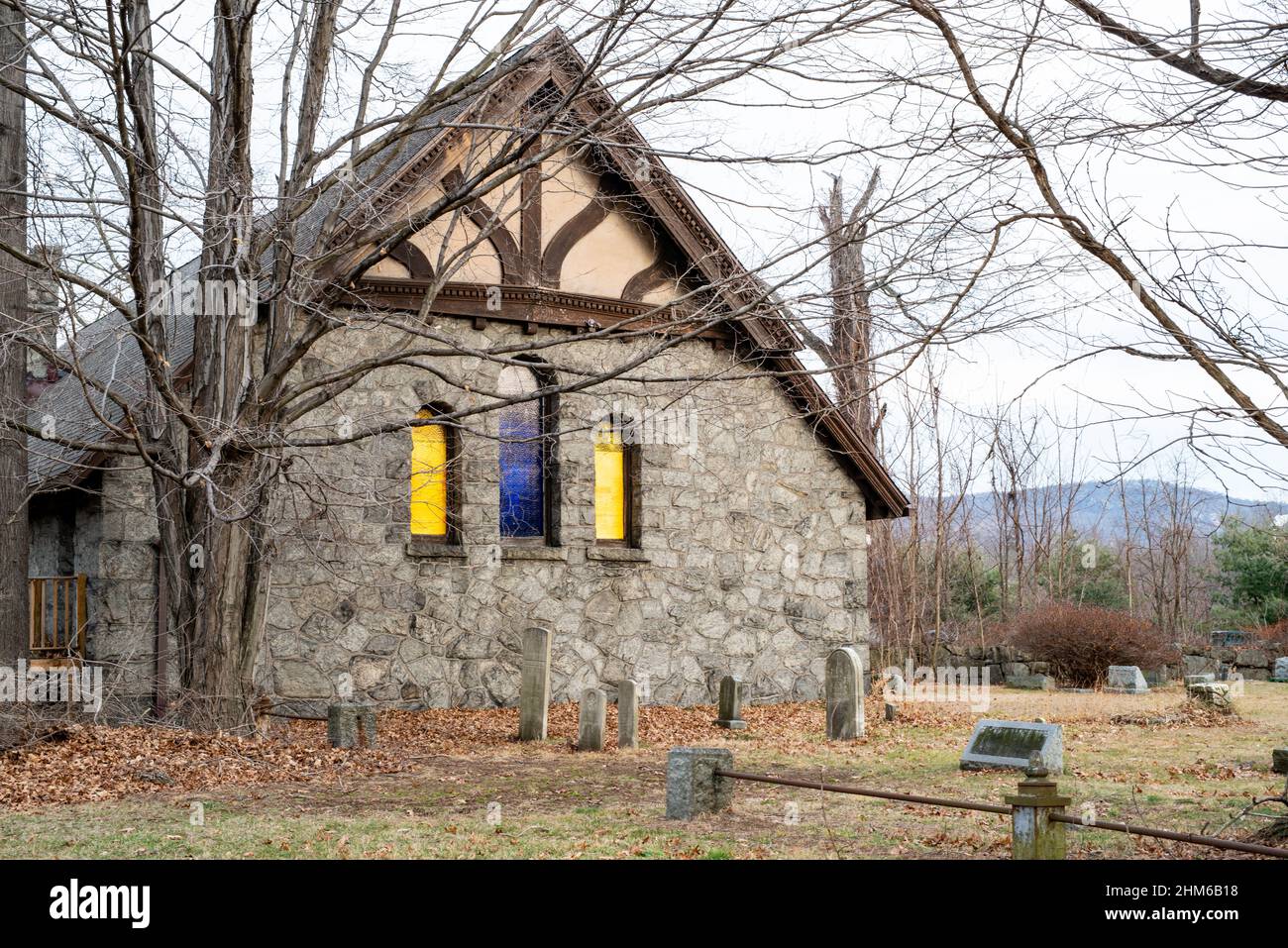 Old Stone Church with windows glowing golden from sunset Stock Photo ...