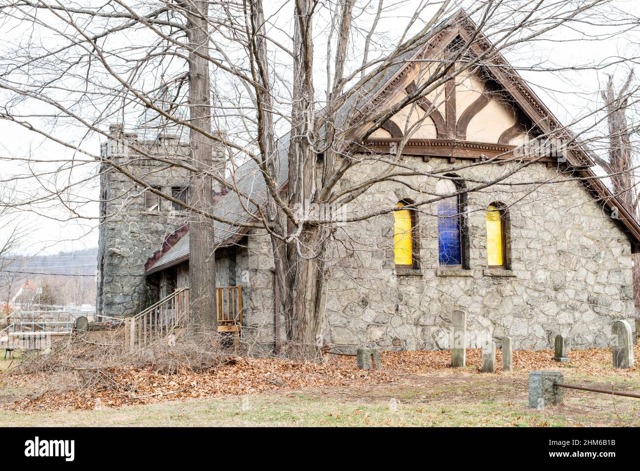 Old Stone Church with windows glowing golden from sunset Stock Photo ...