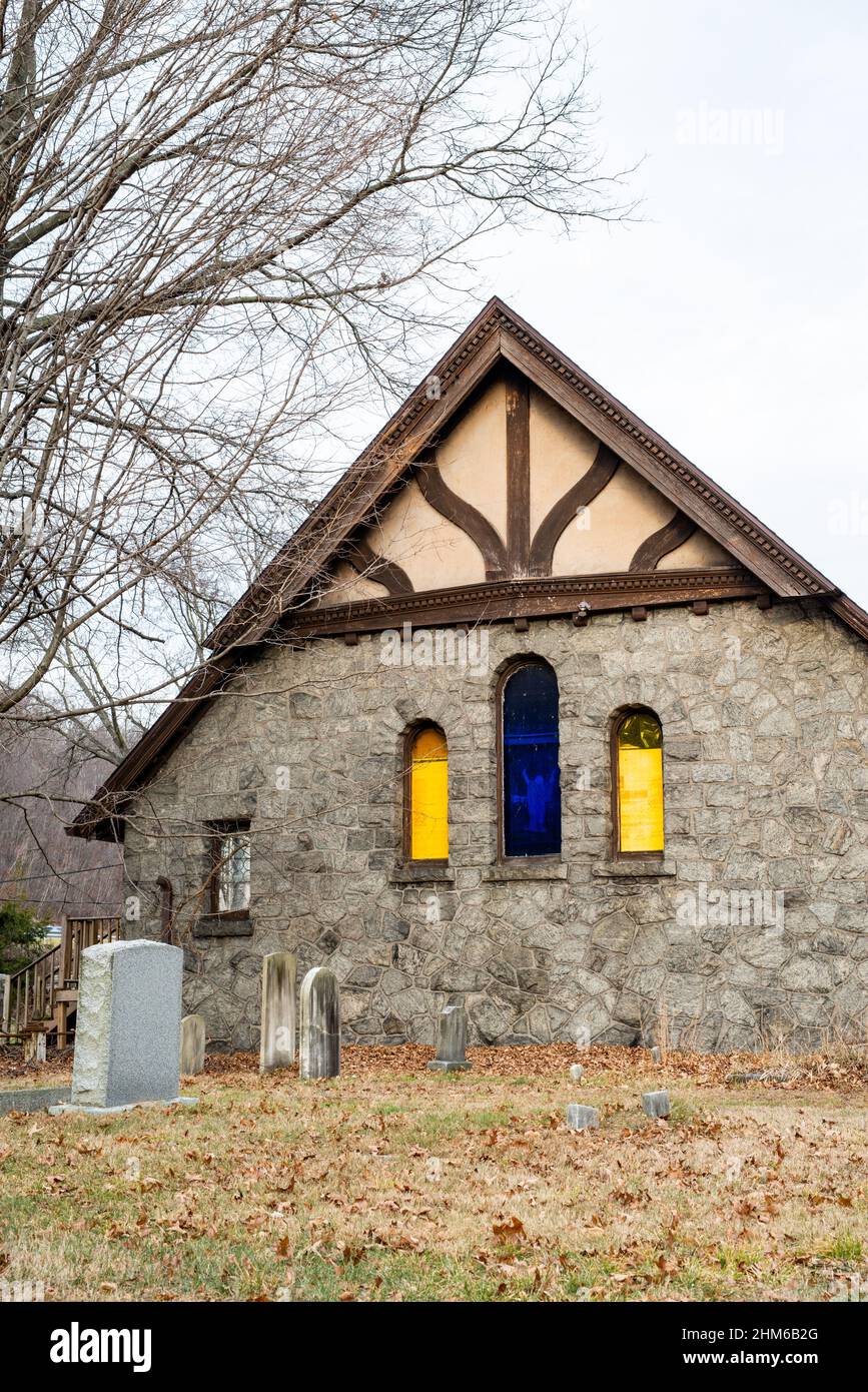 Old Stone Church with windows glowing golden from sunset Stock Photo ...