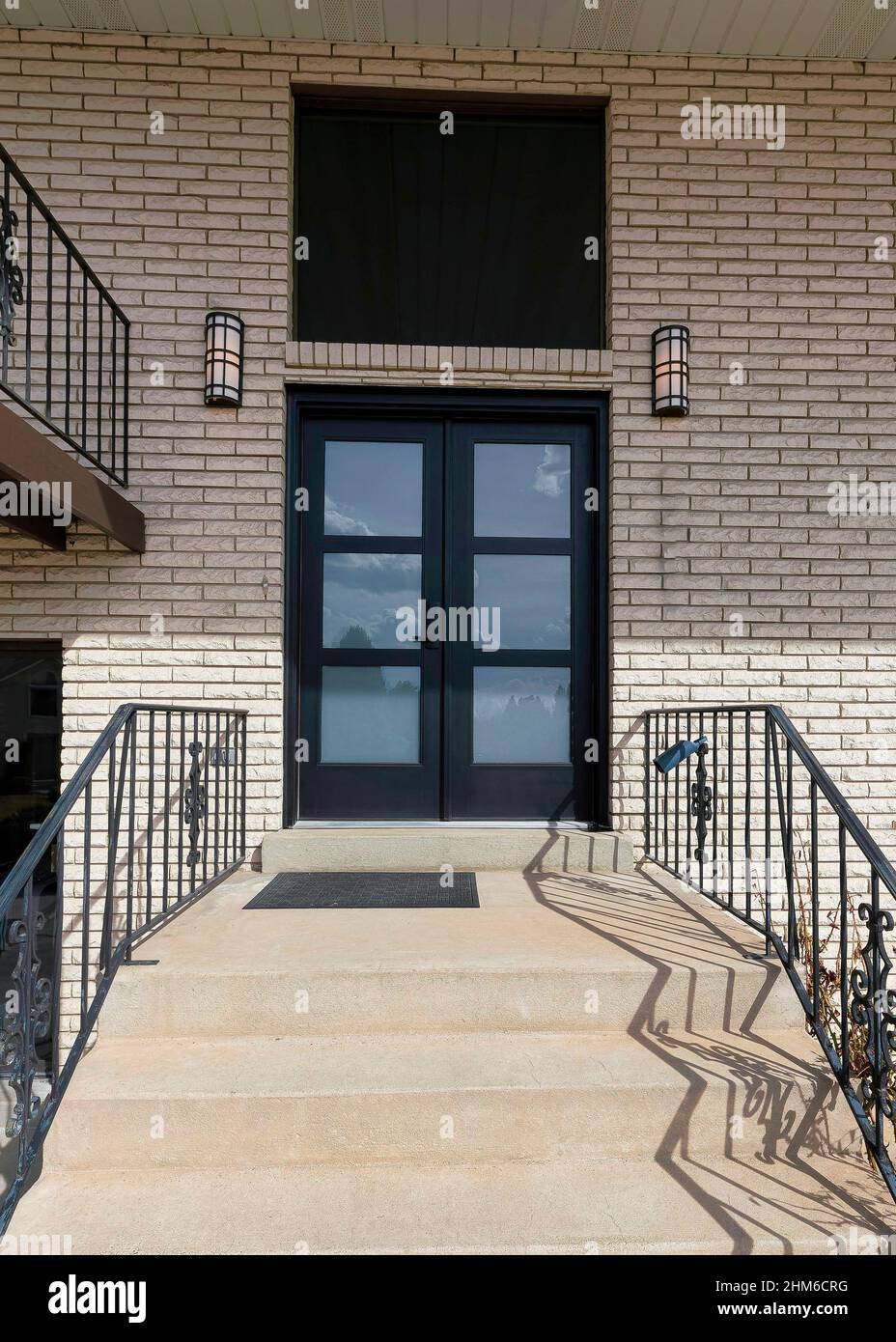 Vertical Concrete doorstep with railings of a modern traditional house ...