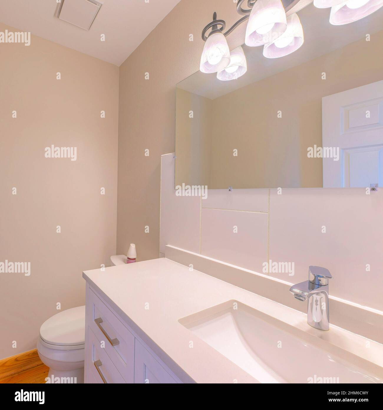Square Small bathroom interior with white tile backsplash on the vanity ...