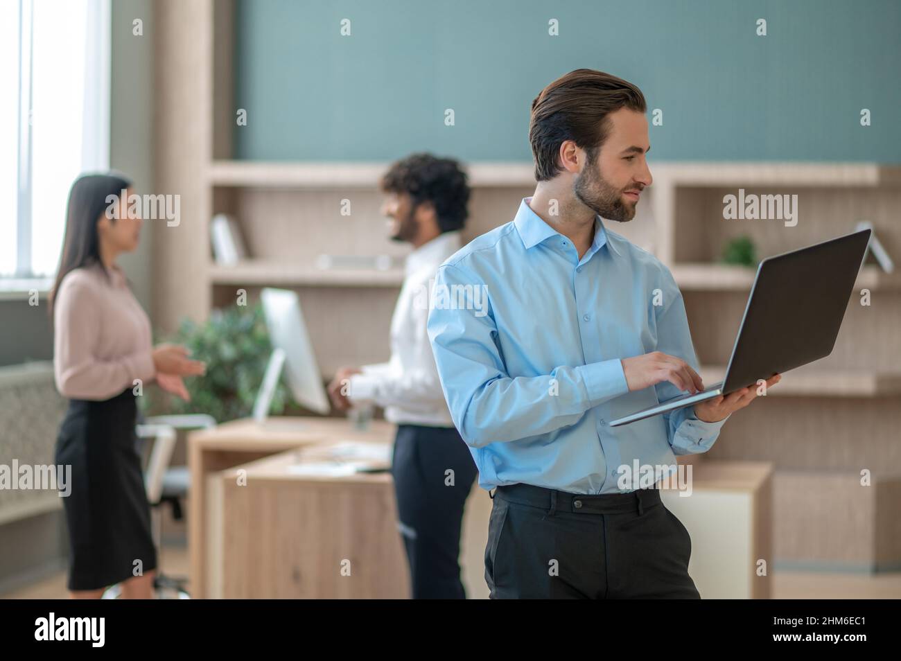 Young male professionals working on hi-res stock photography and images ...