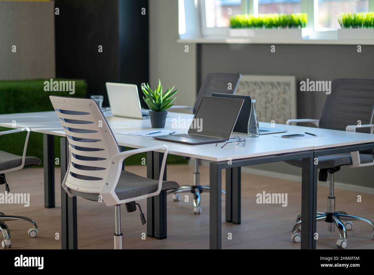 Office premises with a table for negotiations in the middle Stock Photo ...