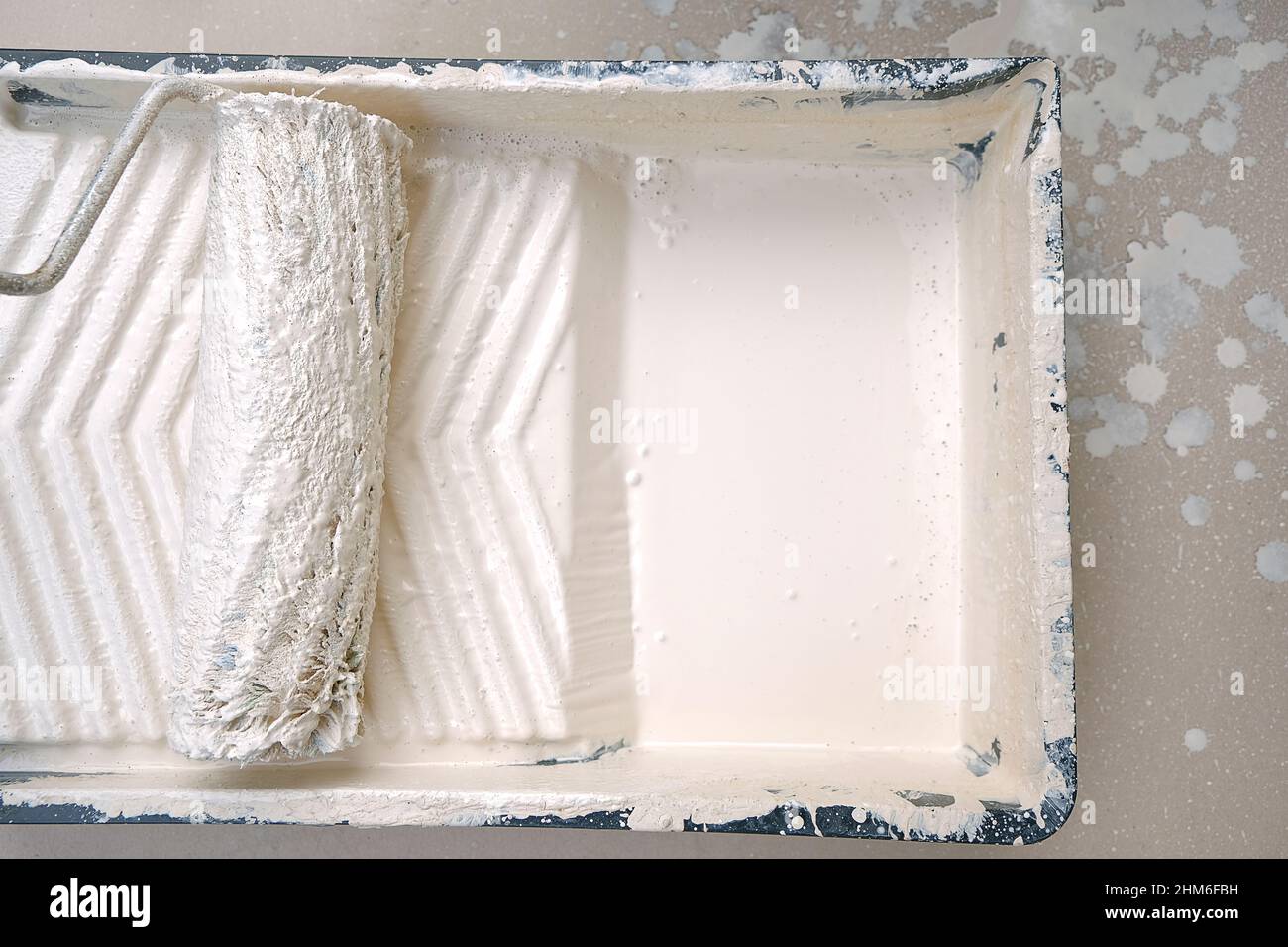 wall painting And renovation. Roller and paint. roller in a container ...