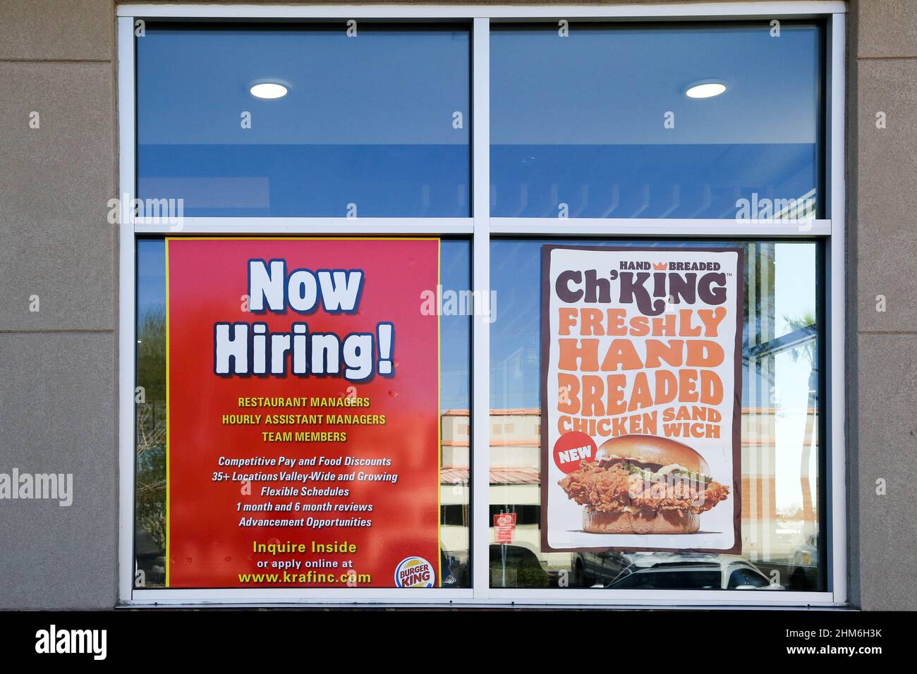 A Now Hiring sign advertising different positions available is ...