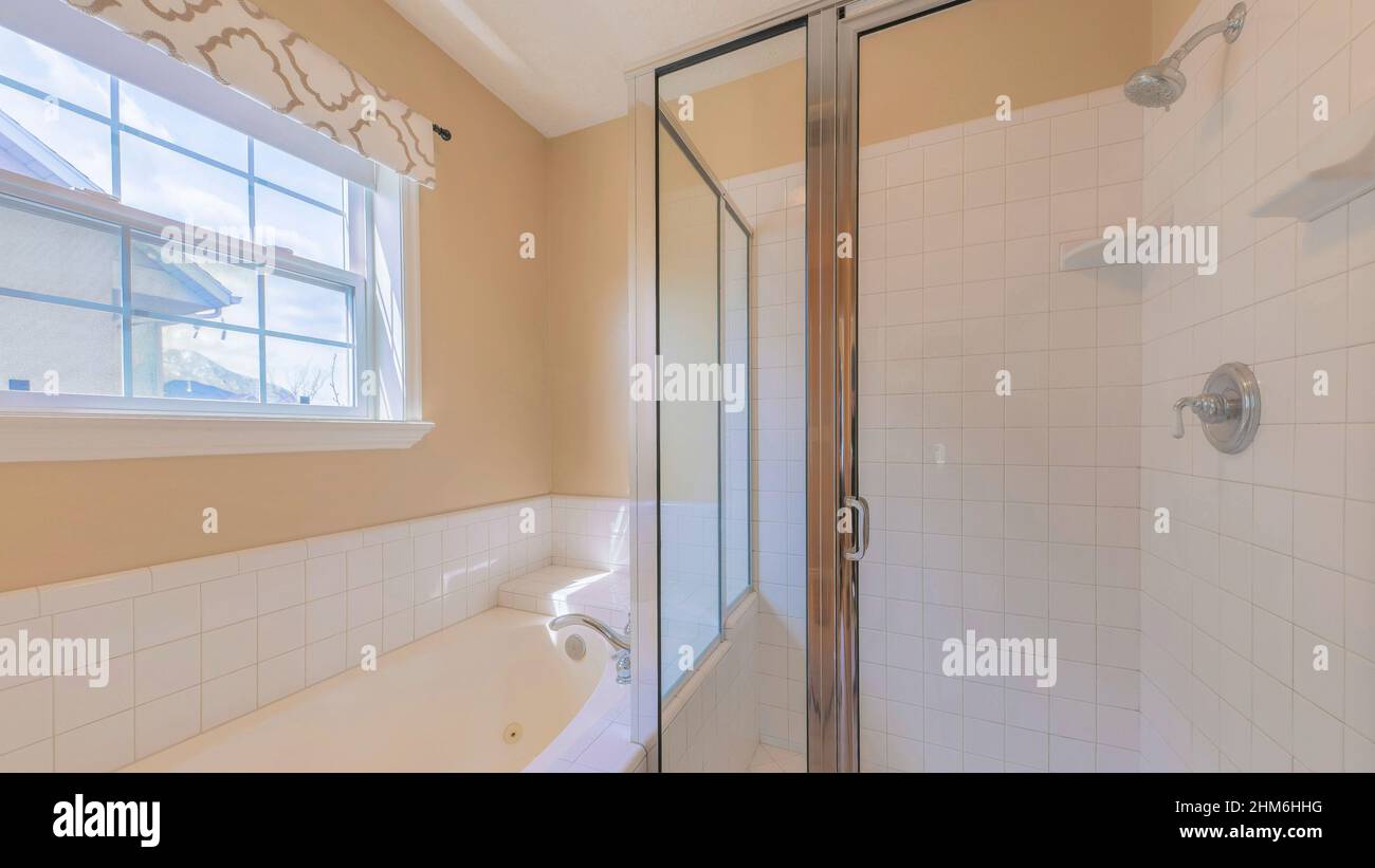 Panorama Glass shower stall and bathtub with white tiles surround Stock ...