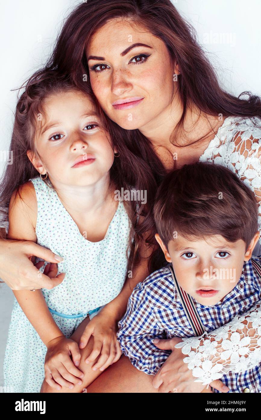 young mother with two children on white background isolated, happy ...