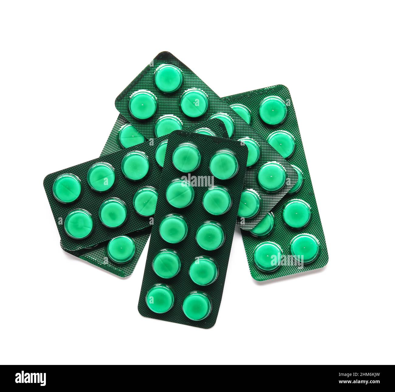 Green blister packs with pills on white background Stock Photo - Alamy