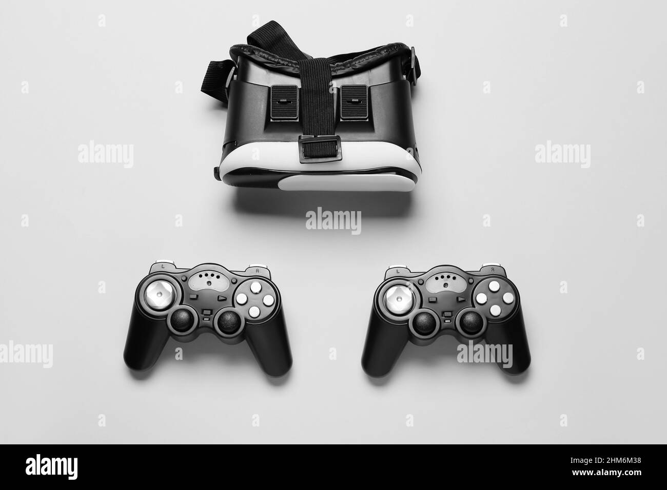 Virtual reality glasses and joysticks on white background Stock Photo ...