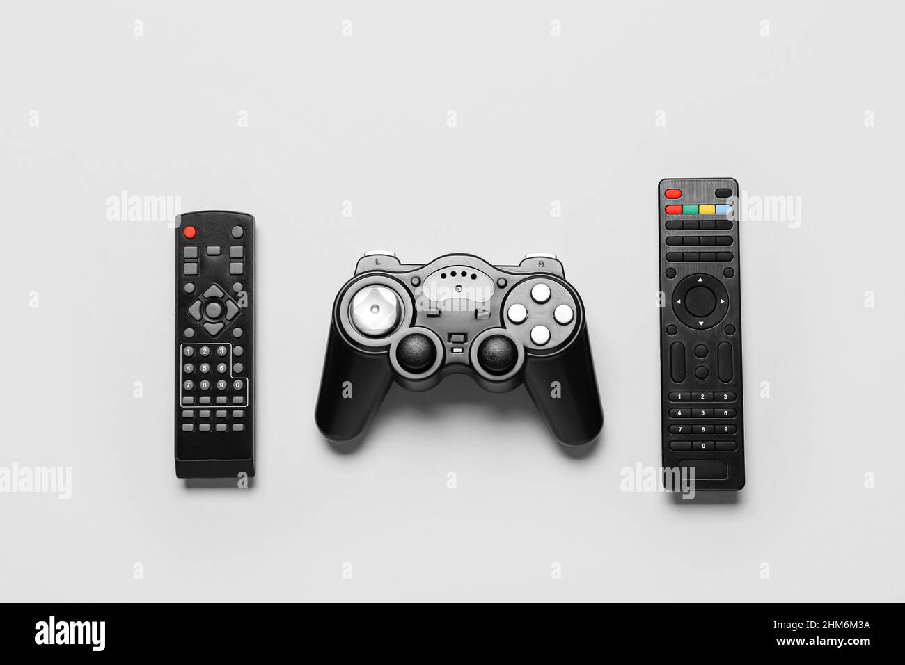 Joystick and remote controllers on white background Stock Photo - Alamy