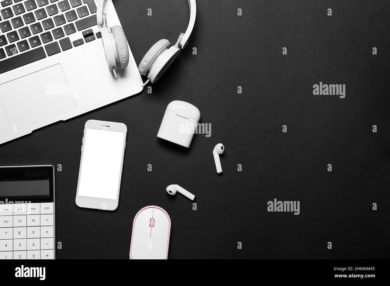 Different gadgets on dark background Stock Photo - Alamy