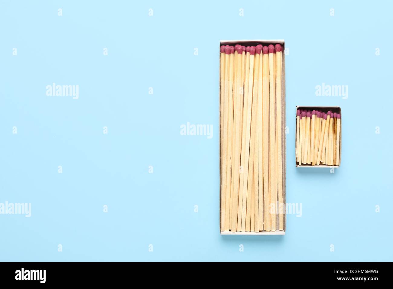 Matchboxes with different matches on color background Stock Photo - Alamy
