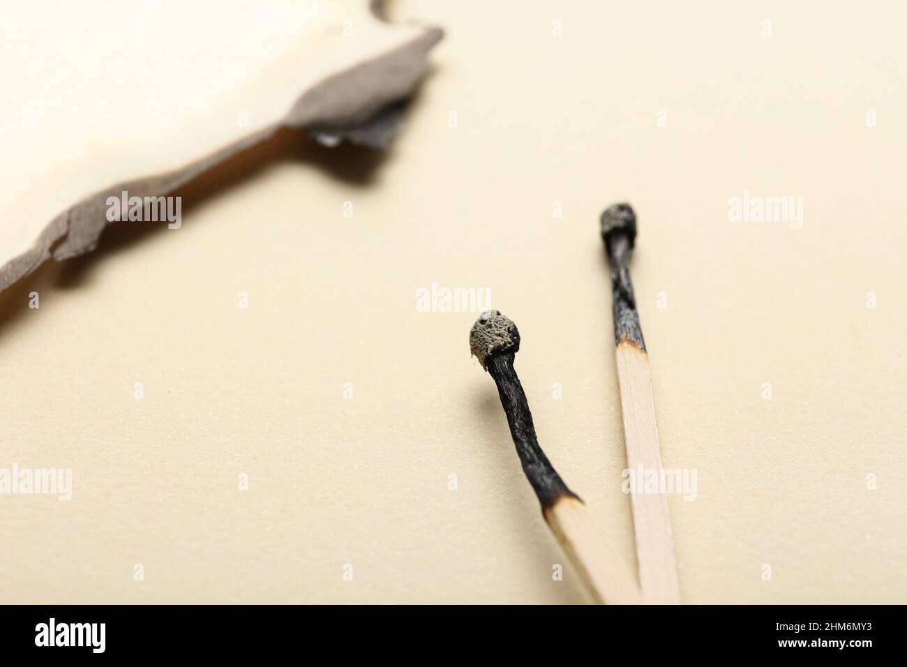 Burnt matches and paper on color background. Concept of burnout Stock ...