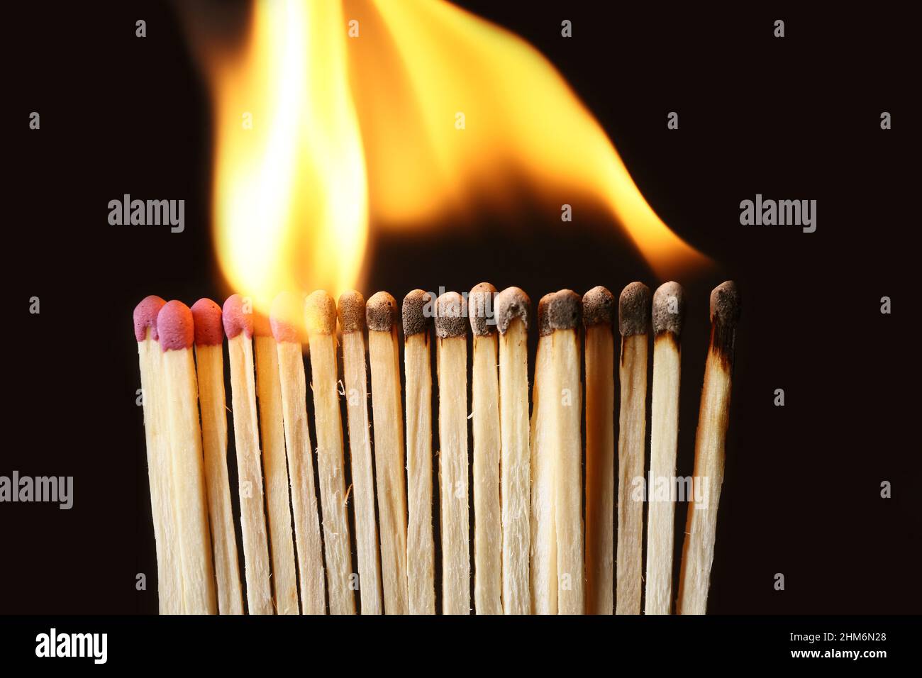 Line of burning matches on black background, closeup. Inspiration ...