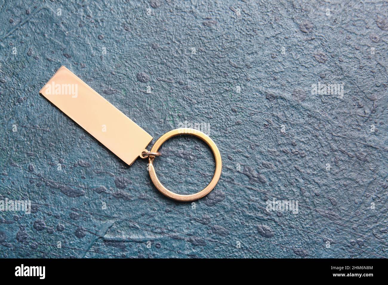 Metallic keychain on dark background Stock Photo - Alamy