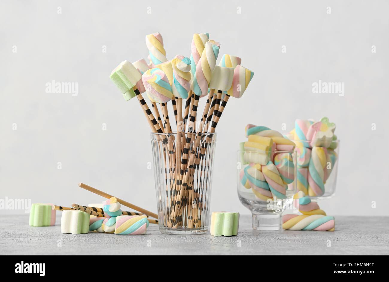 Composition with tasty marshmallows on light background Stock Photo - Alamy