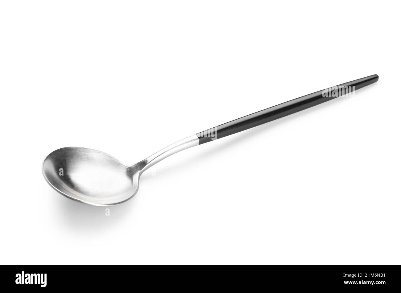 Stainless steel spoon with black handle on white background Stock Photo ...