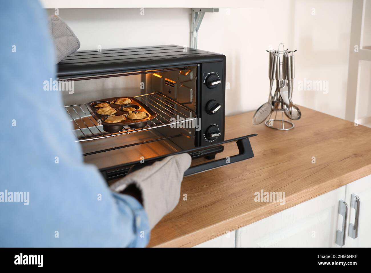 Man preparing muffins in hi-res stock photography and images - Alamy