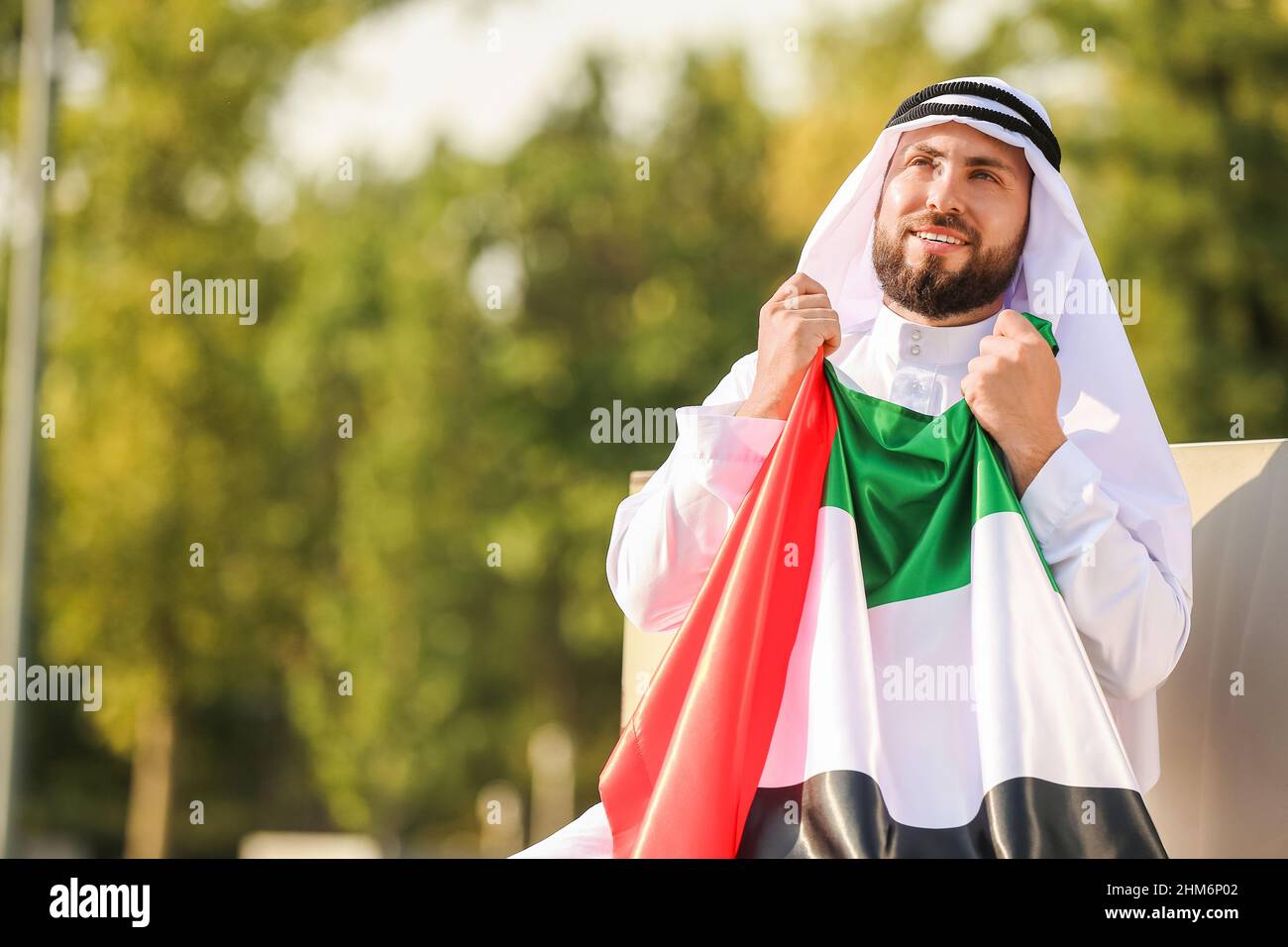 Handsome Muslim man with UAE flag outdoors Stock Photo - Alamy