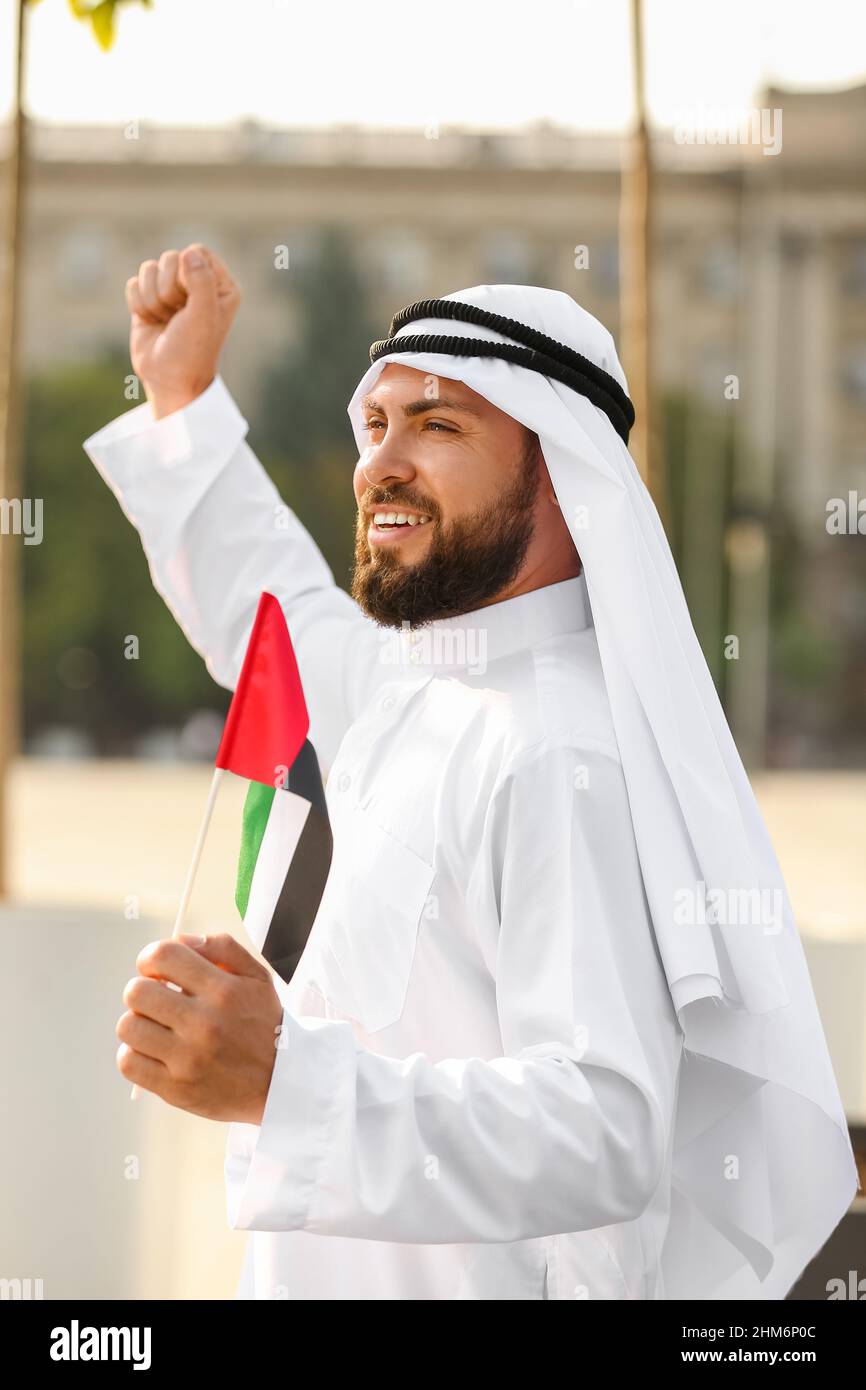 Handsome Muslim man with UAE flag outdoors Stock Photo - Alamy