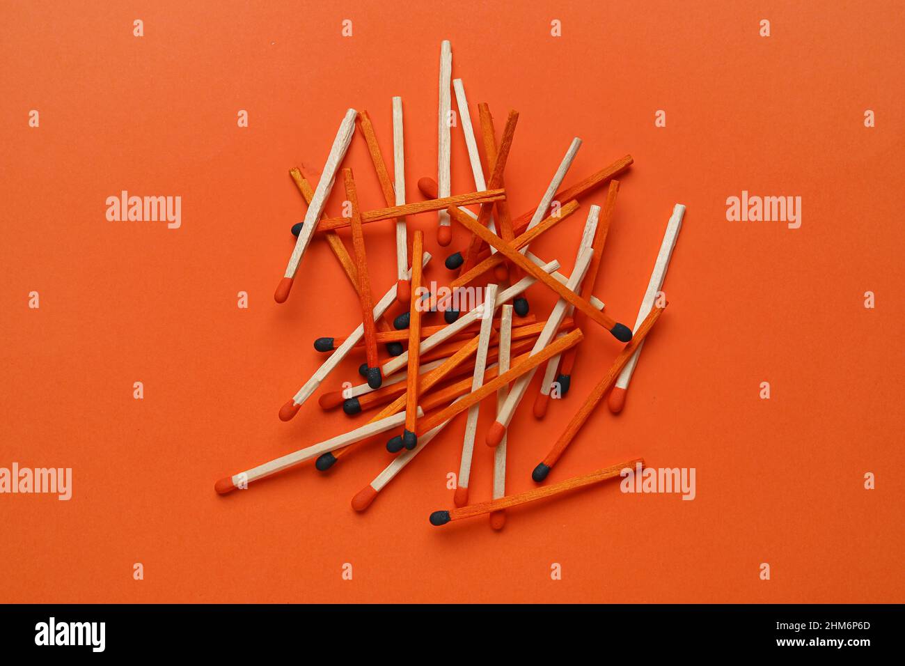 Different new matchsticks on orange background Stock Photo - Alamy