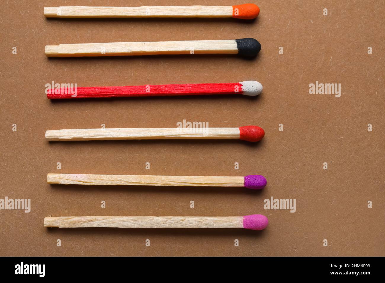 Different new matchsticks on brown background Stock Photo - Alamy