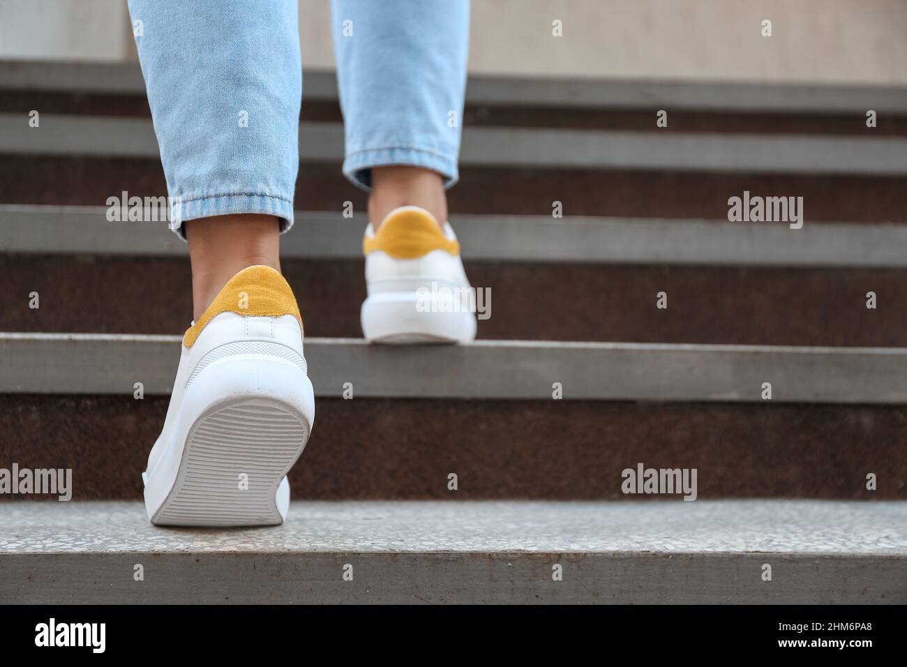 Woman walking upstairs outdoors, closeup Stock Photo - Alamy