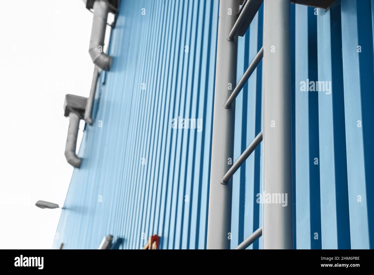 Fire escape metal ladder of blue building outdoors, closeup Stock Photo ...