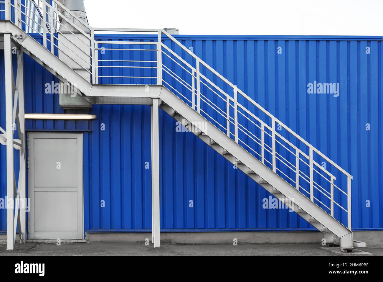 Modern metal stairs of blue building outdoors Stock Photo - Alamy