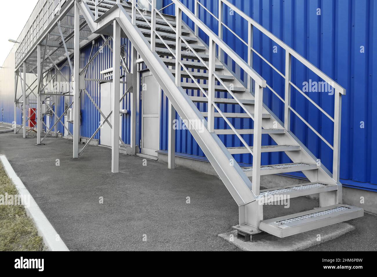 Modern metal stairs of blue building outdoors Stock Photo - Alamy